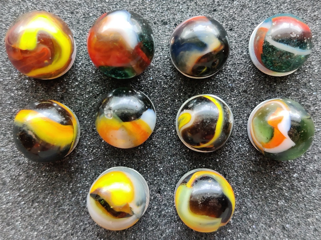 2-3 colors swirled with black, bigger marbles - ALL ABOUT MARBLES